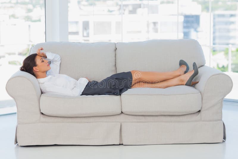 Business Woman Lying Down on the Couch Stock Photo - Image of sofa ...