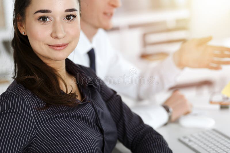 Business Woman and Man Discussing Questions while Using Computer at ...
