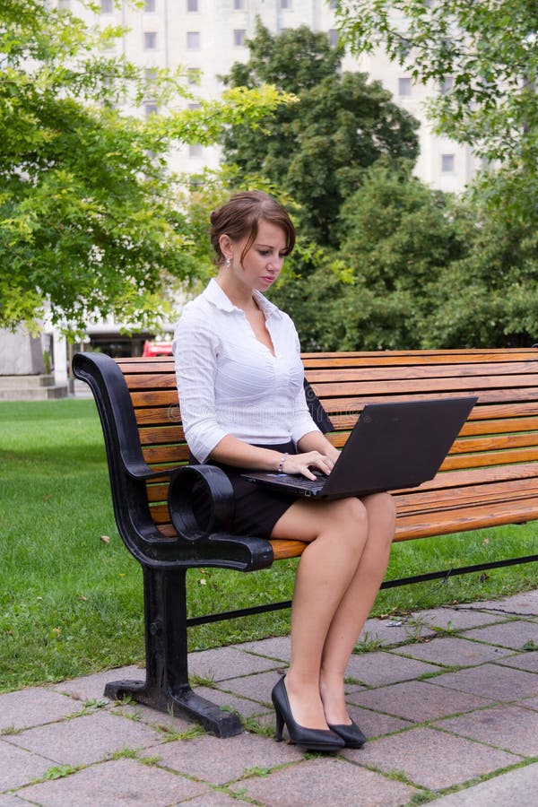 Business Woman on Park Bench Working with Laptop Computer Stock Image ...