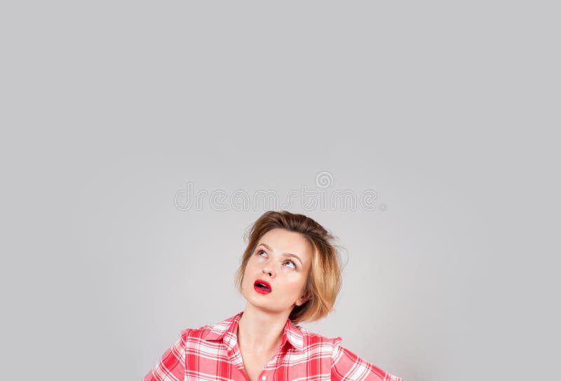 Business Woman with Questioning Expression Looking Up Stock Image ...
