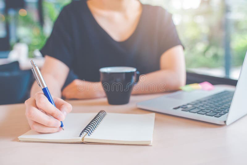 Business Woman`s Hand is Writing on a Notebook with a Pen Stock Image ...