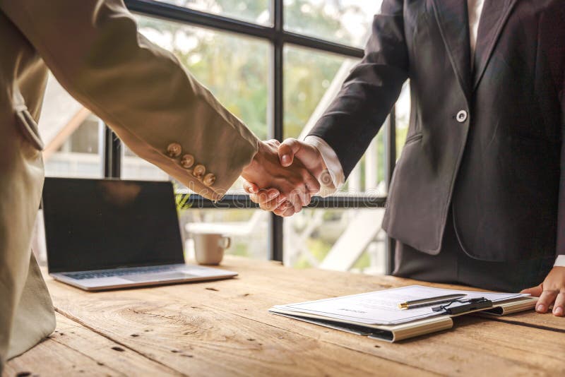 Business Woman are Shaking Hands in Office. Collaborative Teamwork ...