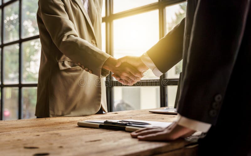 Business Woman are Shaking Hands in Office. Collaborative Teamwork ...