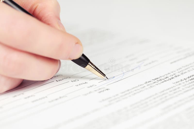 Woman Signing Real Estate Contract Papers with Small Model Home in ...