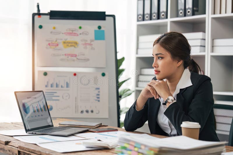 Business Woman Sitting in Front of Laptop Considering Work, Office Work ...