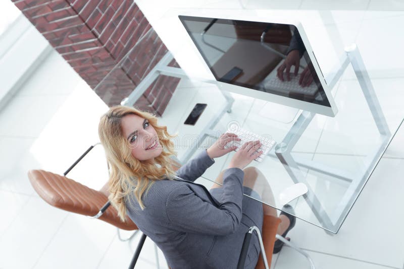 Business Woman Sitting at Her Desk and Looking at Camera Stock Image ... Business Woman Sitting at Her Desk and Looking at Camera Stock Image ...