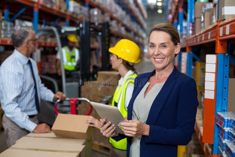 Business Woman Standing in Front Warehouse Worker Stock Image - Image ...