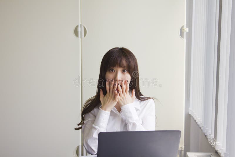 Business Woman Surprised in Front of Laptop Computer in Office Stock ...