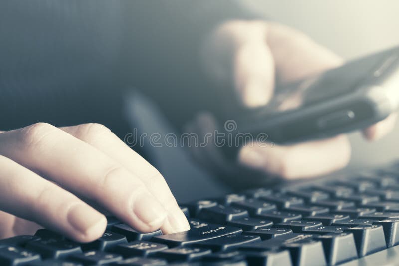 Business Woman Using Computer Keyboard and Calling on Phone Stock Photo ...