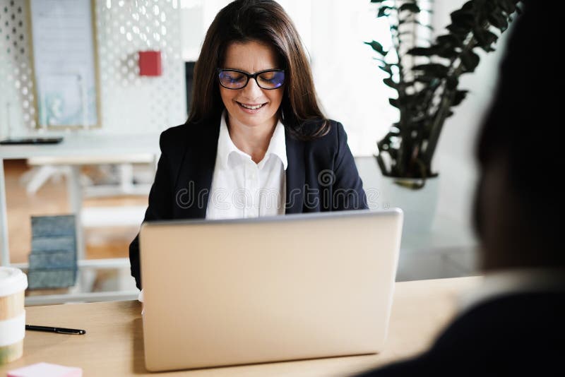Business Woman Using Laptop while Inside Modern Coworking Office ...