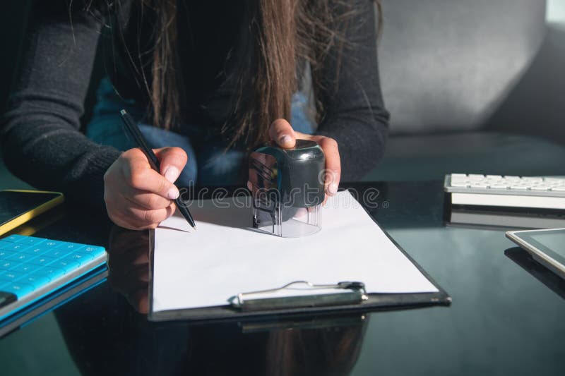 Business Woman Using Stamp on Document Stock Image - Image of office ...