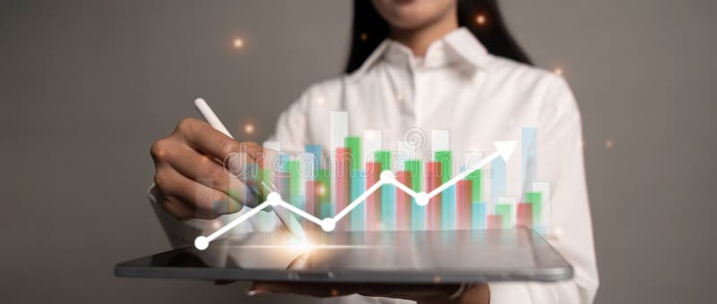 Business Woman Using Tablet To Analysis Sale Data and Economic and ...