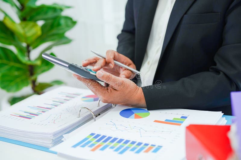 Business Woman Working and Analysis with Statistic Graph in Office ...