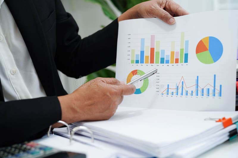 Business Woman Working and Analysis with Statistic Graph in Office ...
