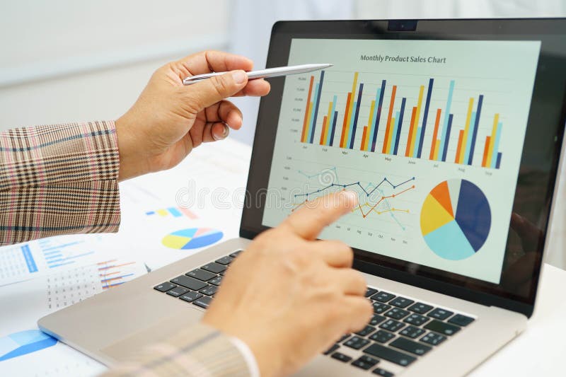 Business Woman Working and Analysis with Statistic Graph in Office ...