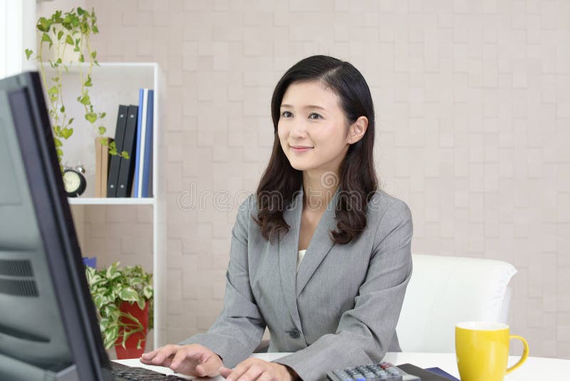 Business Woman Working on a Desktop Personal Computer Stock Photo ...