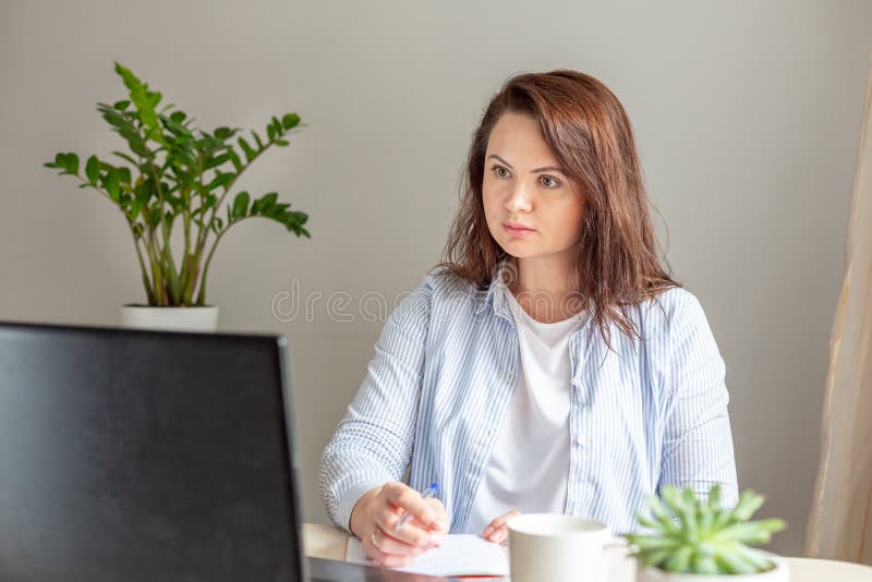 Business Woman Working at Home with a Laptop. Remote, Home Office ...