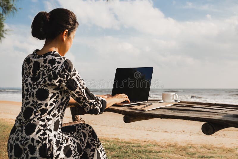 Business Woman Working on Laptop Computer on a Beach on Vacation. Stock ...
