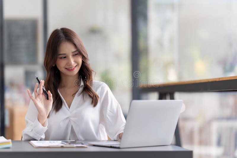 Business Woman Working on Laptop and Working at Office Desk at Office ...