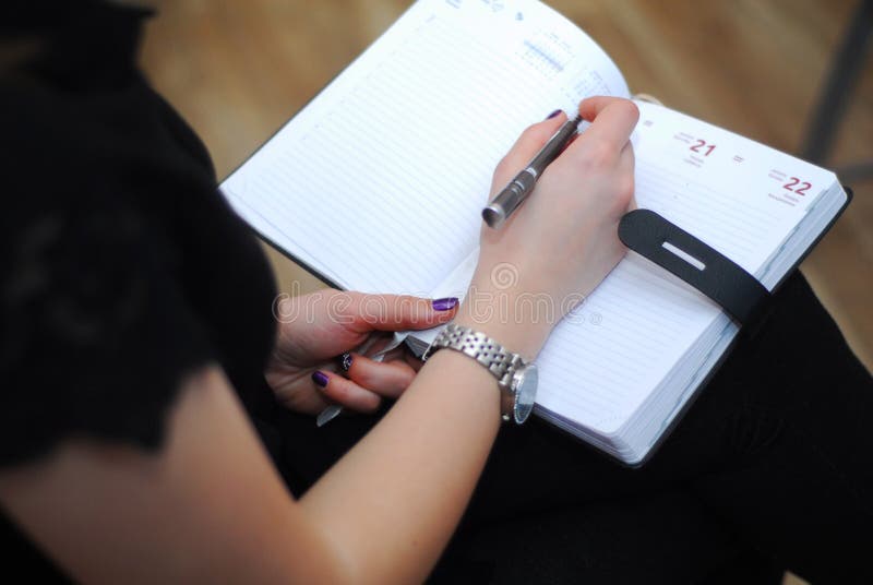 Business Woman Writes Notes in a Notebook Stock Image - Image of ...
