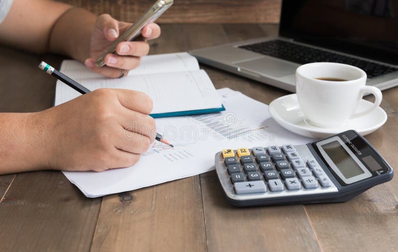 Business Woman Writing and Analyzing Graphs on Work Table Stock Image ...