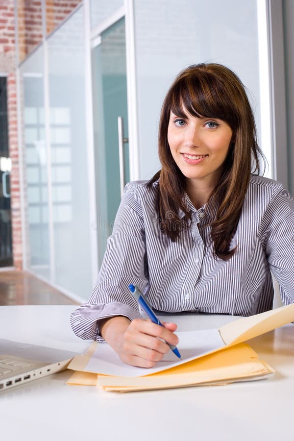 Business Woman Writing Notes at Desk Stock Photo - Image of loft ...