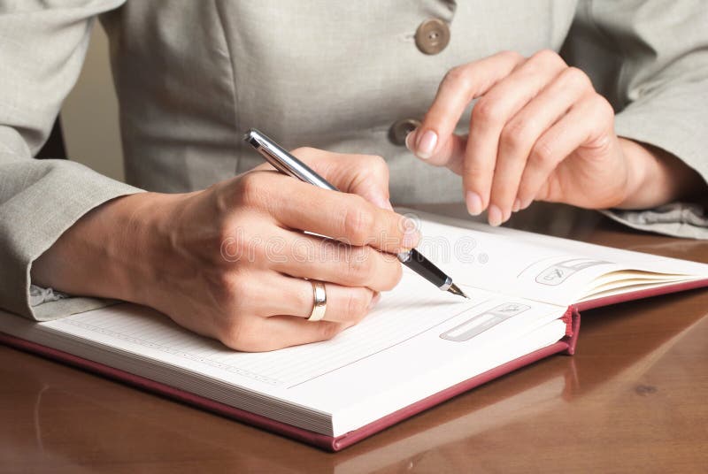 Business Woman Writing with Pen in Notepad Stock Photo - Image of ...
