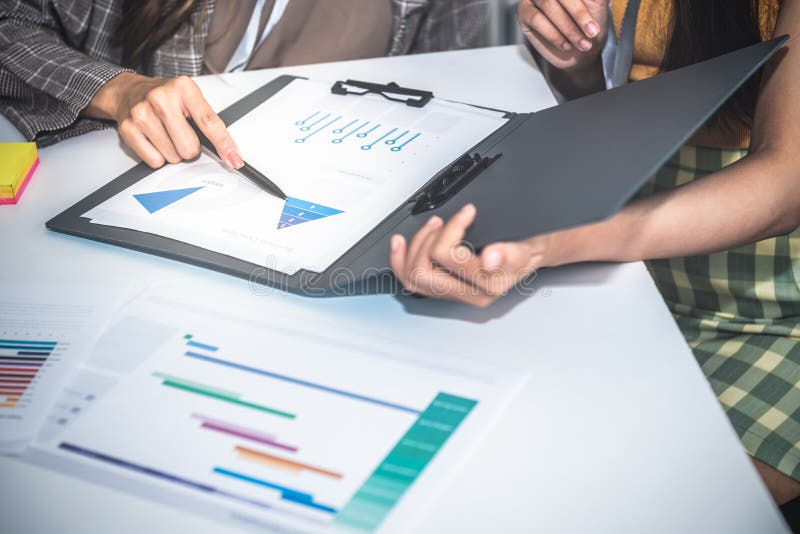 2 Business Women are Consulting, Analyzing Plans and Plan Work Together ...