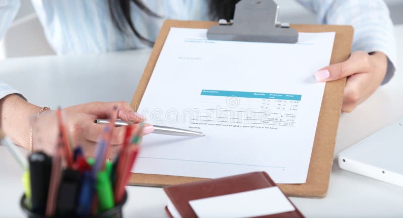 Business Women Sitting on Desk and Writing a Paper Stock Image - Image ...