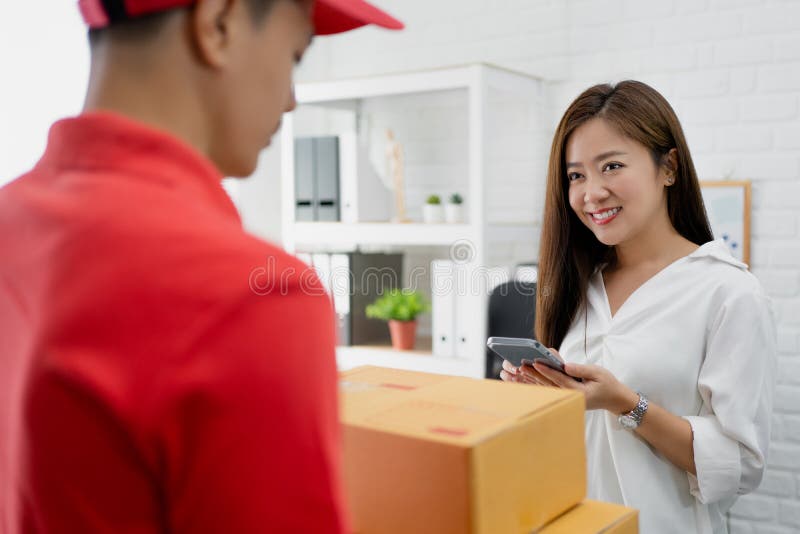 Business Women Take the Box from Home Delivery. she is in Office Stock ...