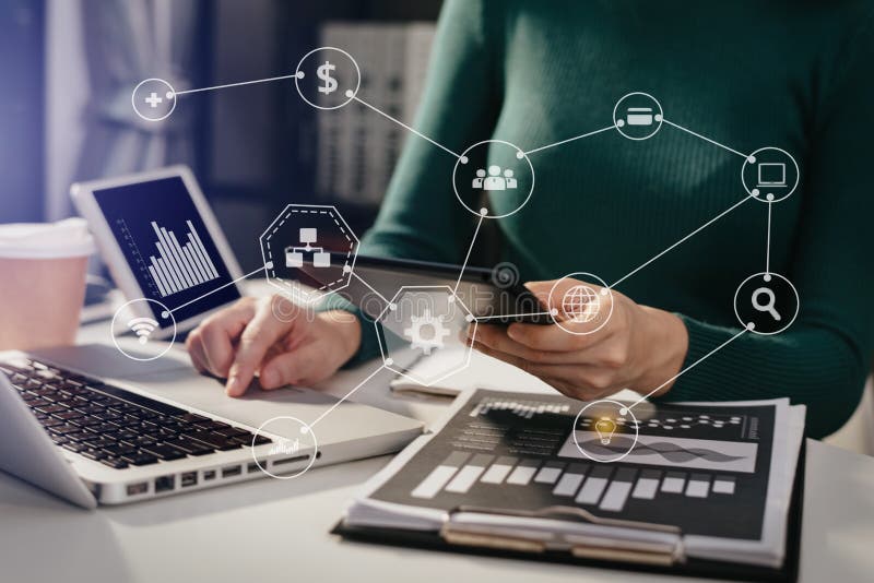 Business Women Using Tablet with Laptop and Document on Desk in Modern ...