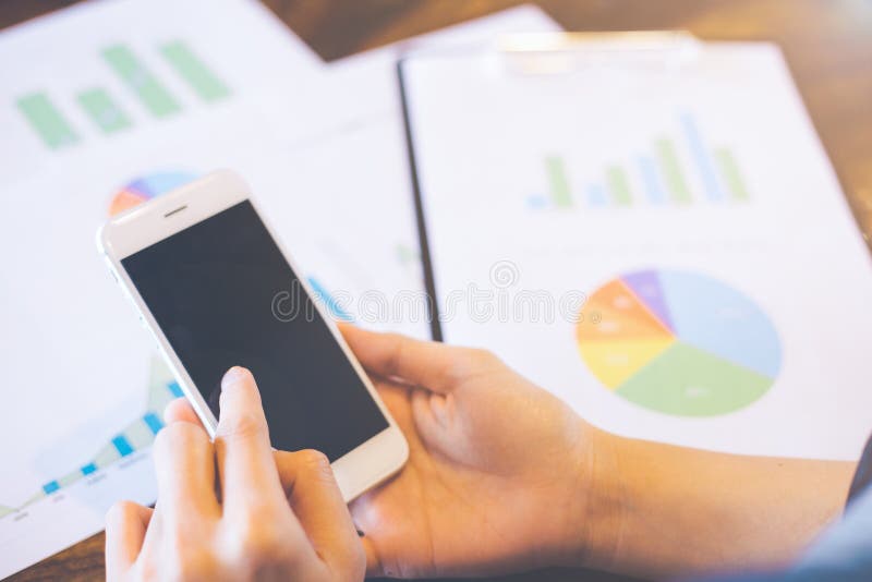 Business Work with Mobile Phones on Statistics and Business Graphs ...