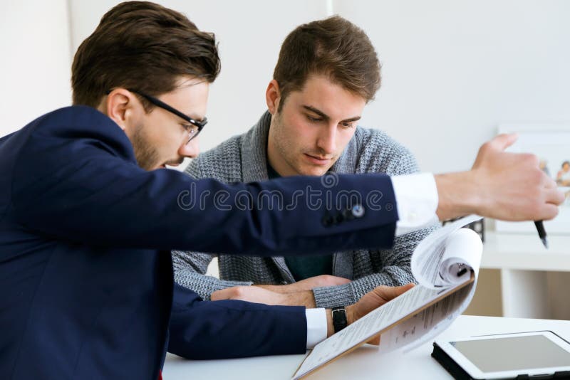Business Young Man Explaining Terms of Contract To His Client in Stock ...