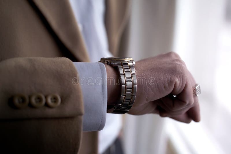Man looking at his watch stock photo. Image of late, watch - 7787504