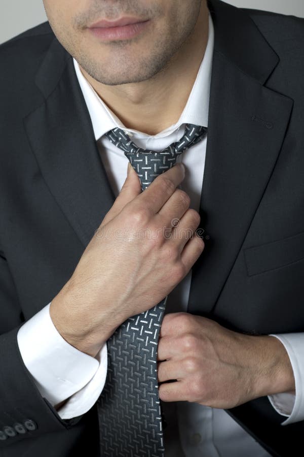 Man adjusting his tie stock image. Image of corporate - 32284435