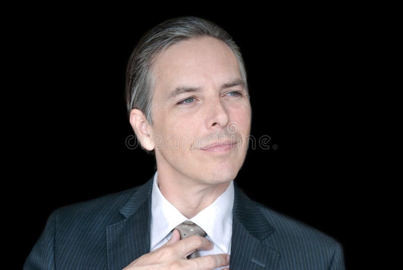 Businessman Adjusting Tie, Looking Off Camera Stock Photo - Image of ...