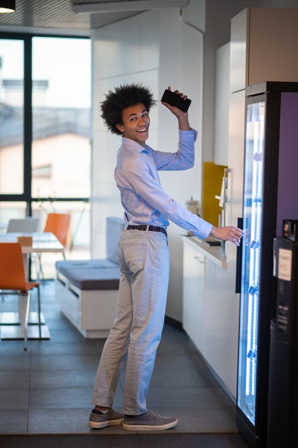 Businessman with Afro Hairstyle Preparing Coffee in Kitchen of Modern ...