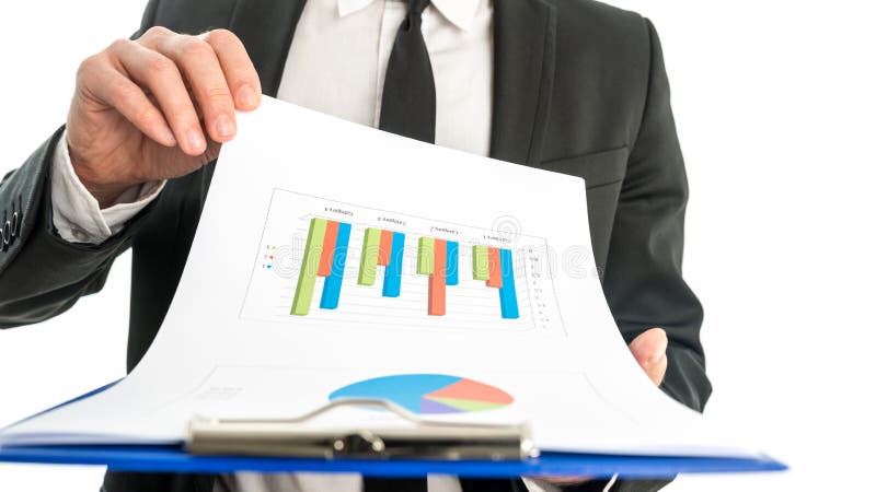 Businessman Analysing a Set of Graphs and Holding a Map with Sta Stock ...