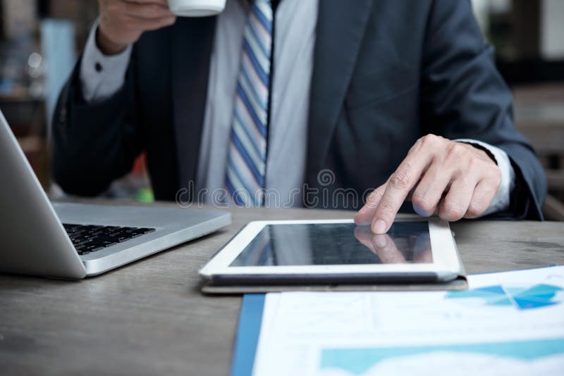 Businessman Analyzing Data on Tablet Computer Stock Photo - Image of ...