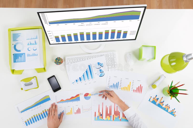 Businessman Analyzing Graph on Computer at Desk Stock Photo - Image of ...