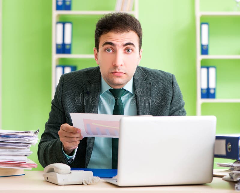 Businessman Angry with Excessive Work Sitting in the Office Stock Photo ...