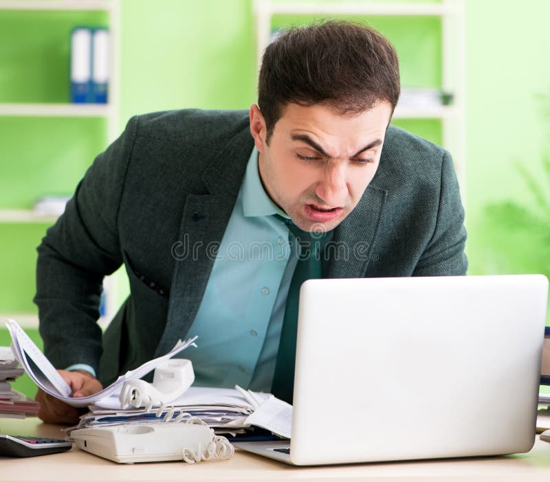 Businessman Angry with Excessive Work Sitting in the Office Stock Photo ...