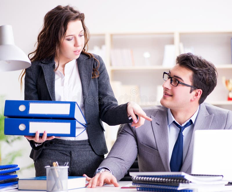 Businessman Asking for Paperwork from His Assistant Secretary Stock ...