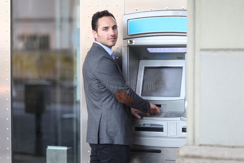 Businessman at the ATM stock image. Image of smile, secret - 41023849