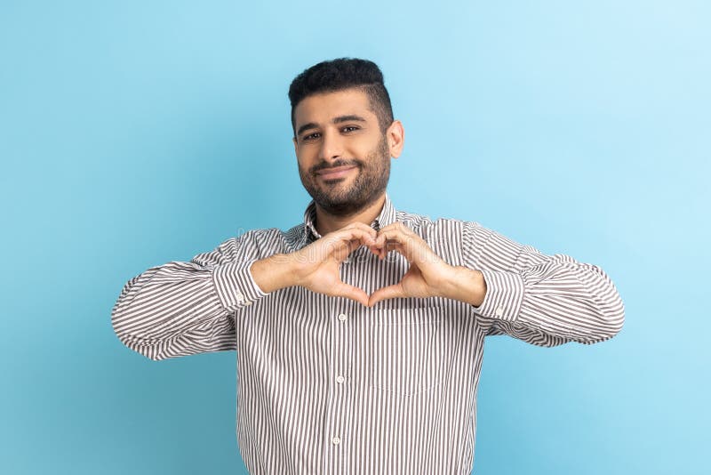 Businessman with Beard Standing, Showing Heart Shape Making with Hands ... Businessman with Beard Standing, Showing Heart Shape Making with Hands ...