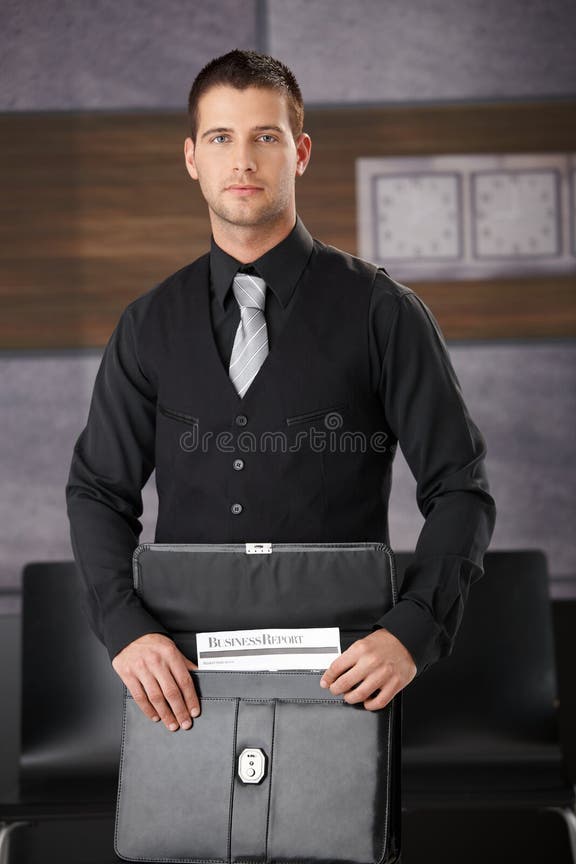 Businessman in Black Packing Briefcase Stock Photo - Image of ...