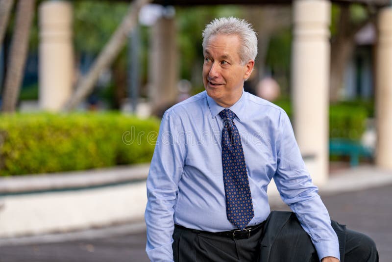 Businessman in a Blue Shirt and Tie Glancing Over His Shoulder Stock ...