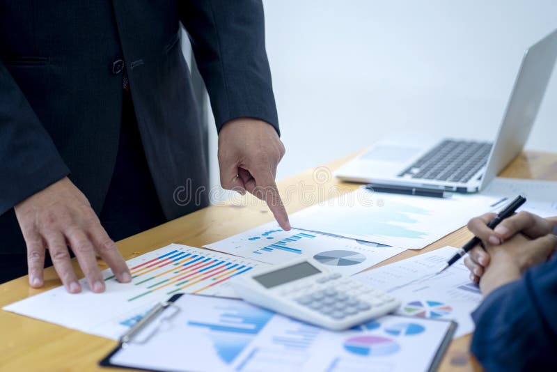 Businessman Boss of the Team Point To Graph and Chart Stock Photo ...