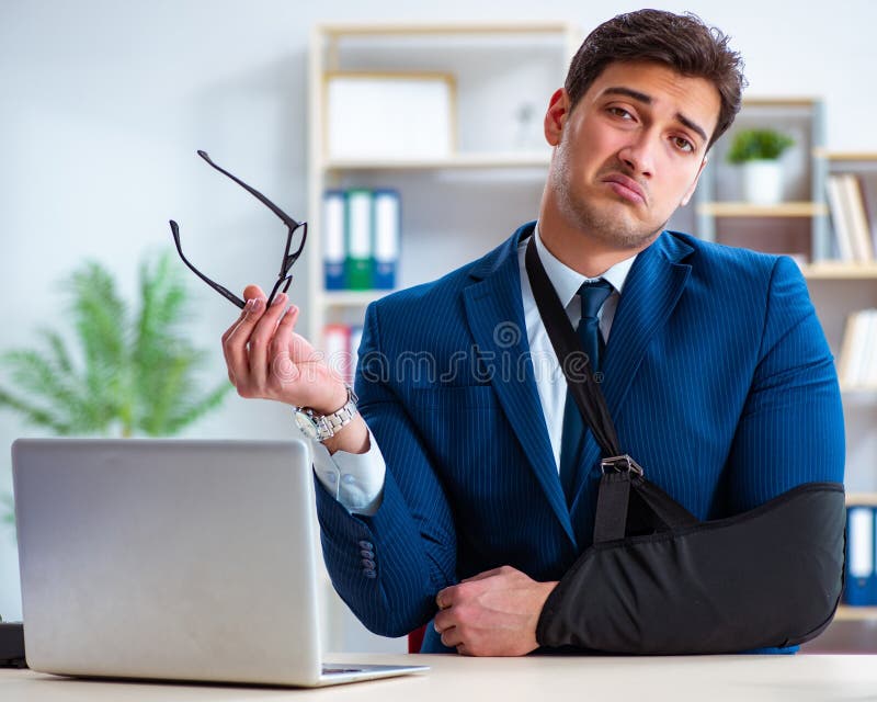 Businessman with Broken Arm Working in Office Stock Image - Image of ...