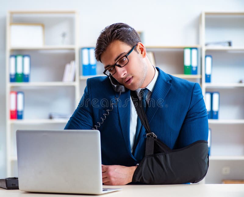 Businessman with Broken Arm Working in Office Stock Image - Image of ...